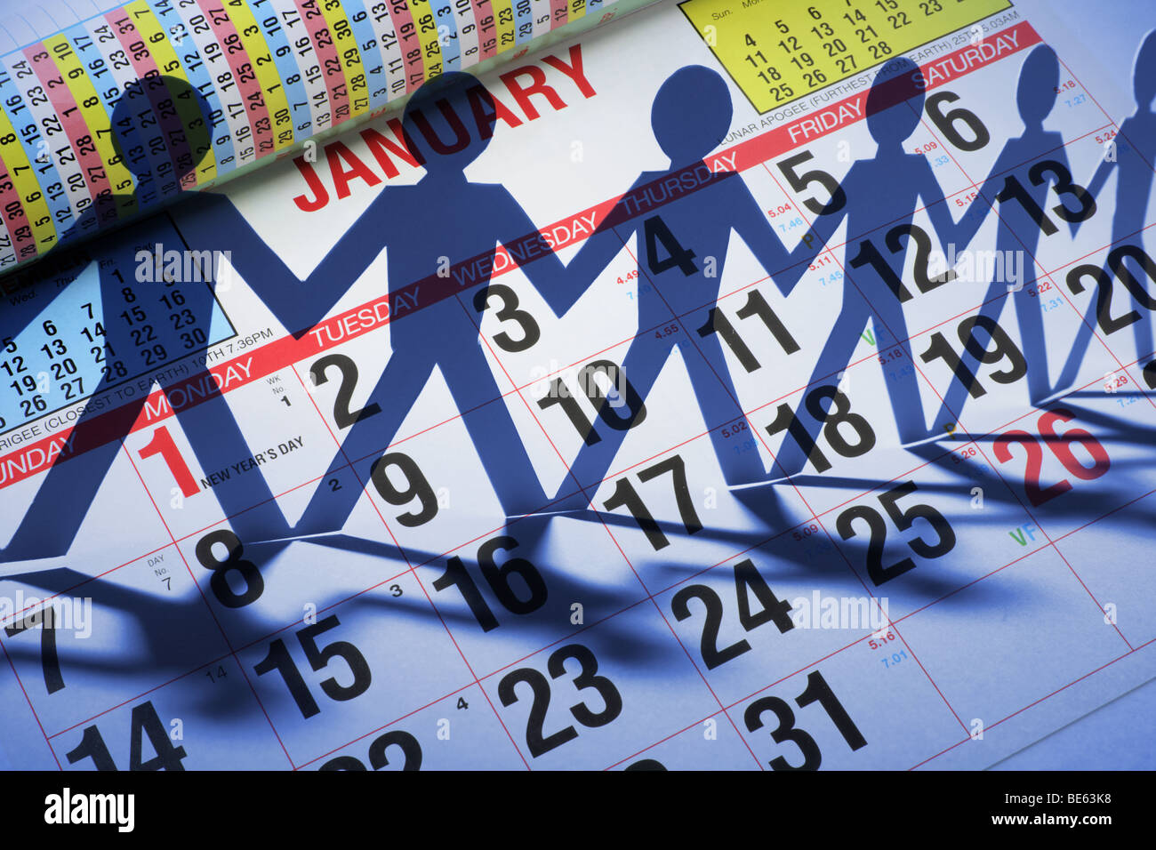 Calendar and Paper Chain Dolls Stock Photo - Alamy