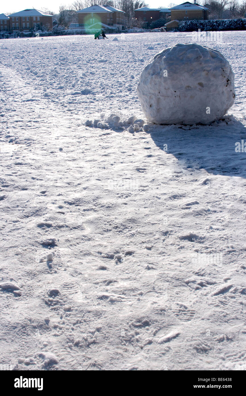 Huge snowball left in a park Stock Photo - Alamy