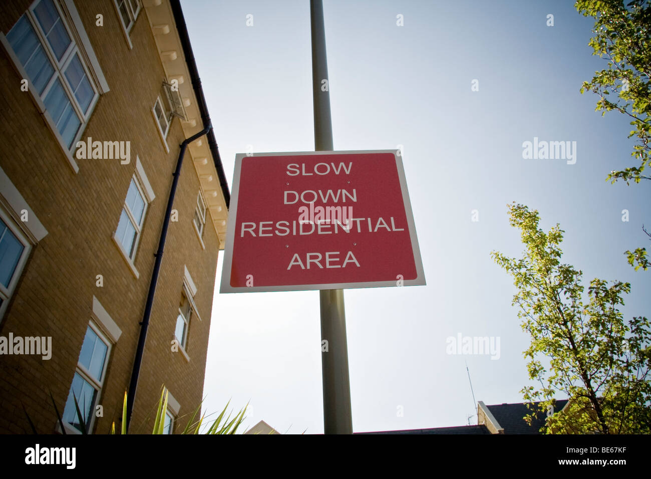 Slow down sign Stock Photo - Alamy