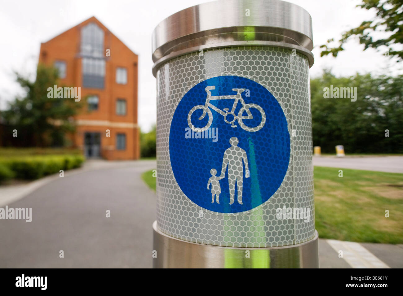 A sign for a combined walk way and cycle path on the designer housing ...