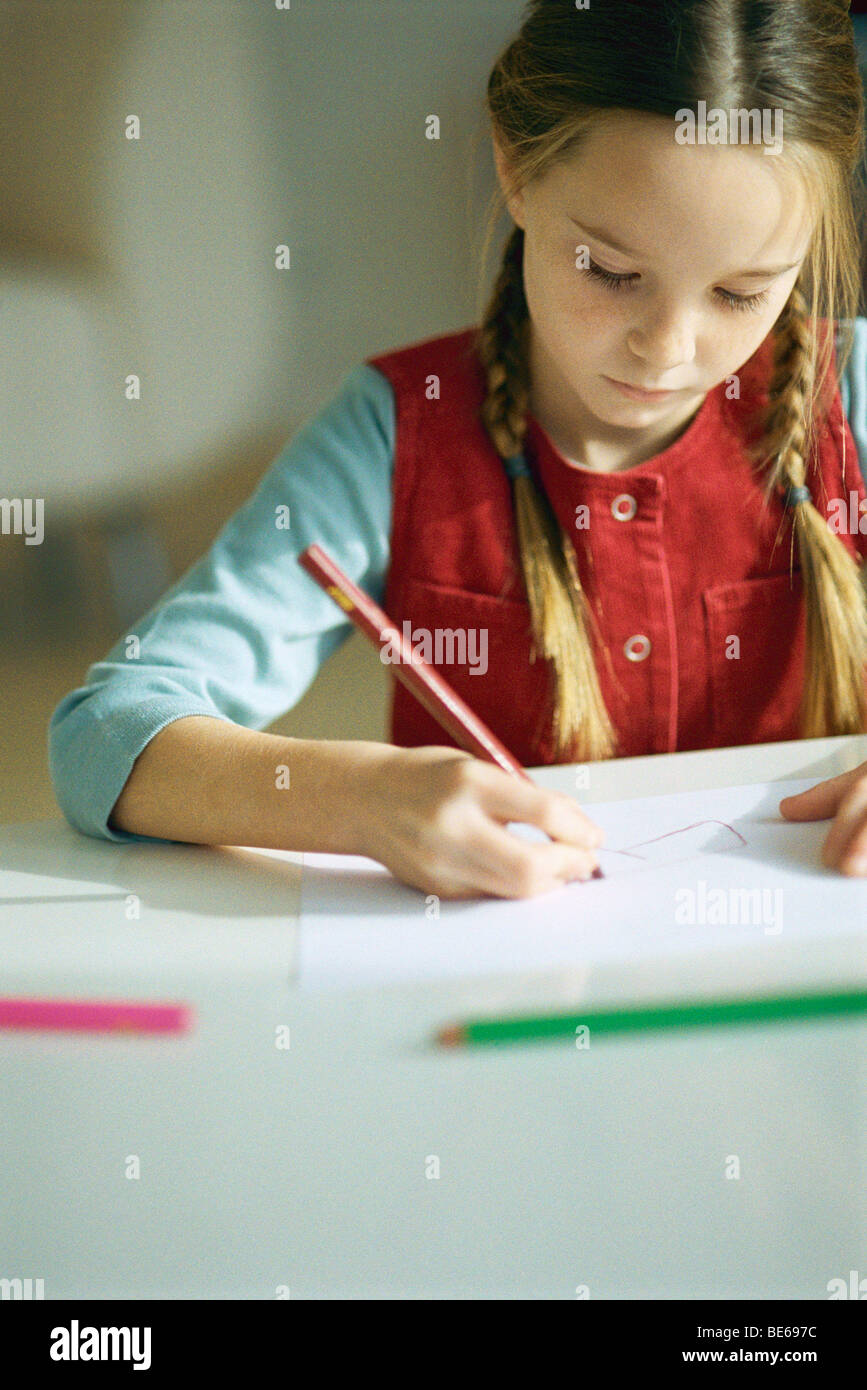 Little girl drawing with colored pencils Stock Photo - Alamy