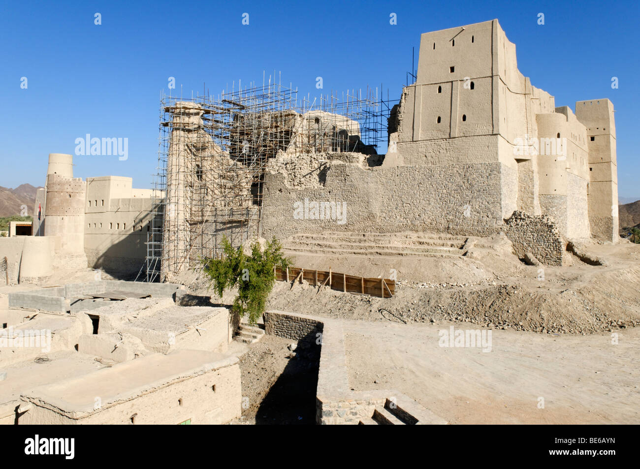 Renovation works at the historic adobe fortification Bahla fort or ...