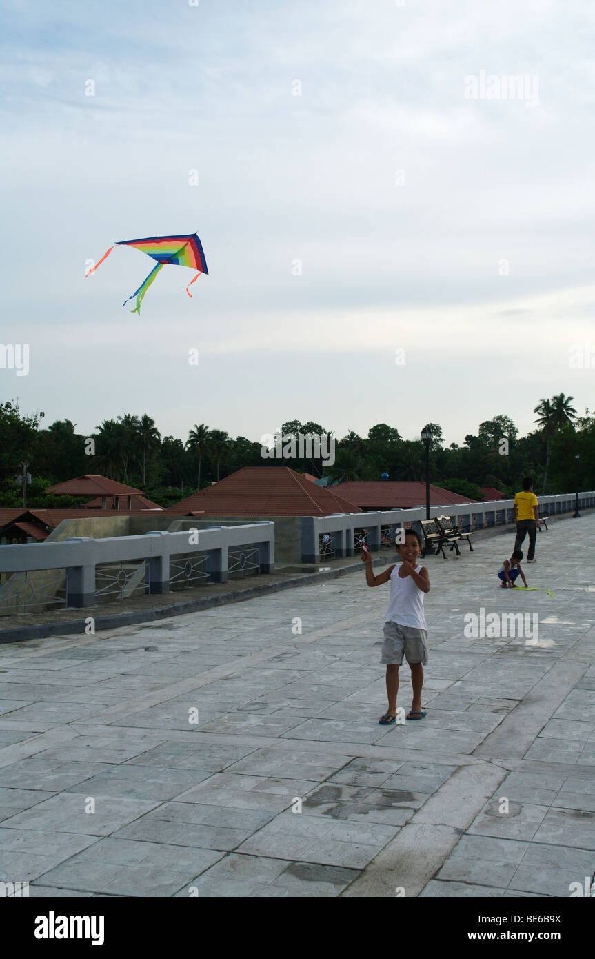 Child flying a kite, Loboc, Bohol, The Visayas, Philippines Stock Photo ...