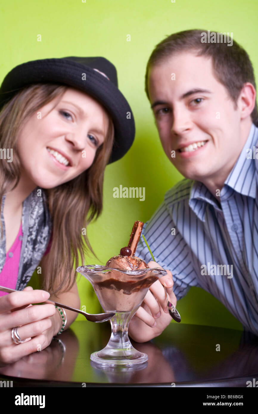 Couple sharing ice cream sundae hi-res stock photography and images - Alamy