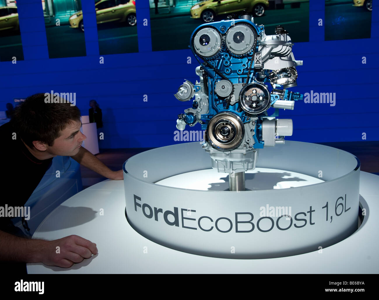 Man examines new efficient Eco Boost engine from Ford at the Frankfurt ...