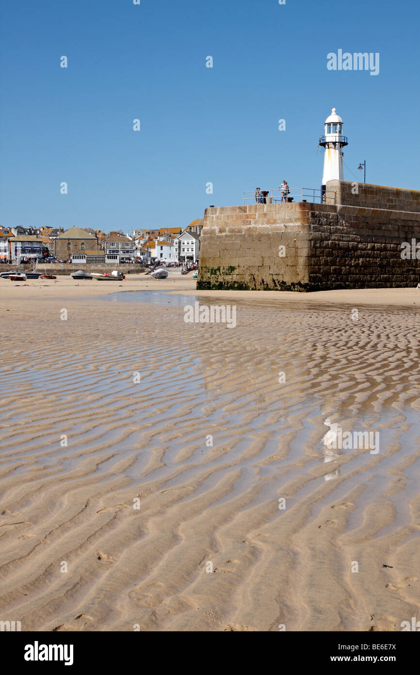 Ripples on St. Ives harbour beach and Smeaton's pier on a low spring ...