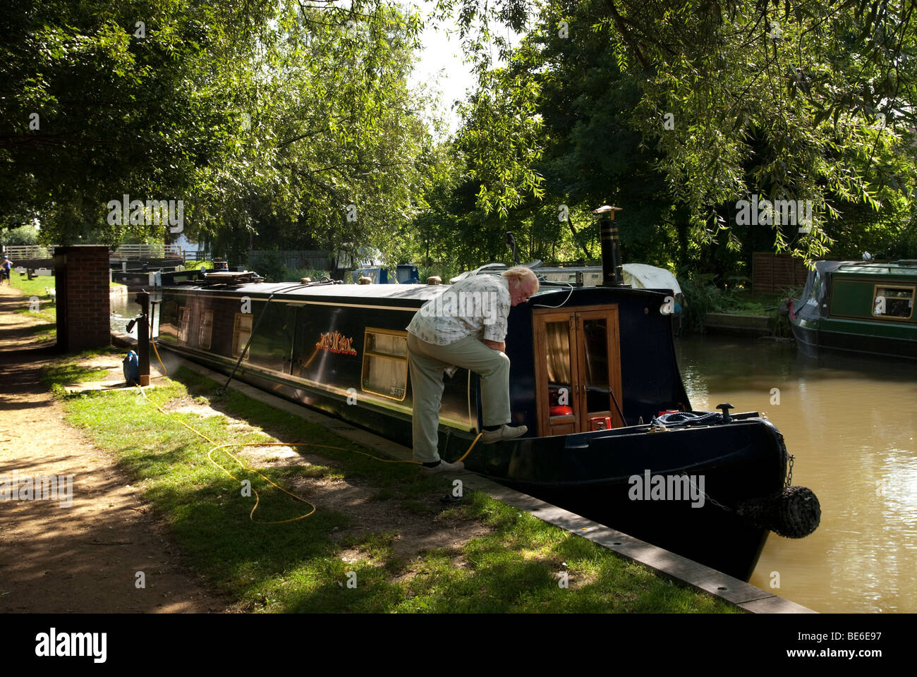 Replenishing water on a Narrow boats on the Kennet and Avon Canal at ...