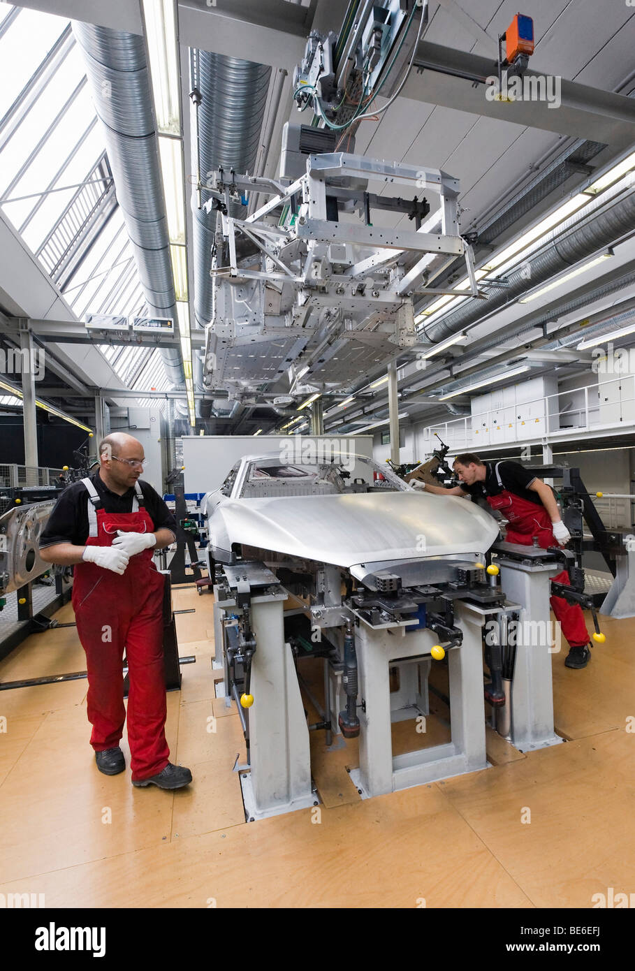 Audi employees assembling the frame of an Audi R8 sports car in the ...