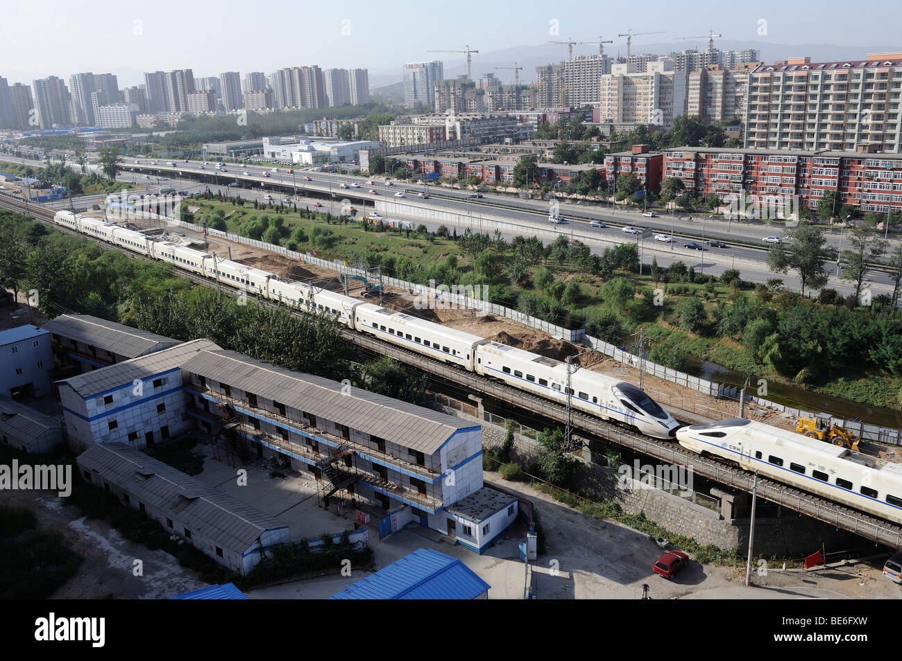 A CRH (China Railway High-speed) bullet train through Beijing city. 21 ...
