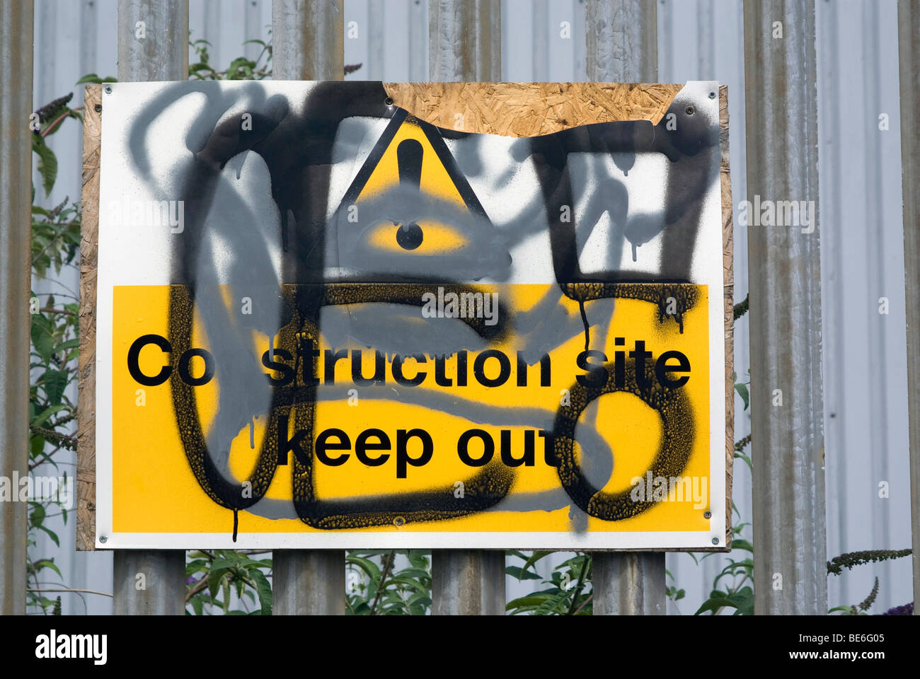 Close up of graffiti covered keep-out sign on metal railings Stock ...