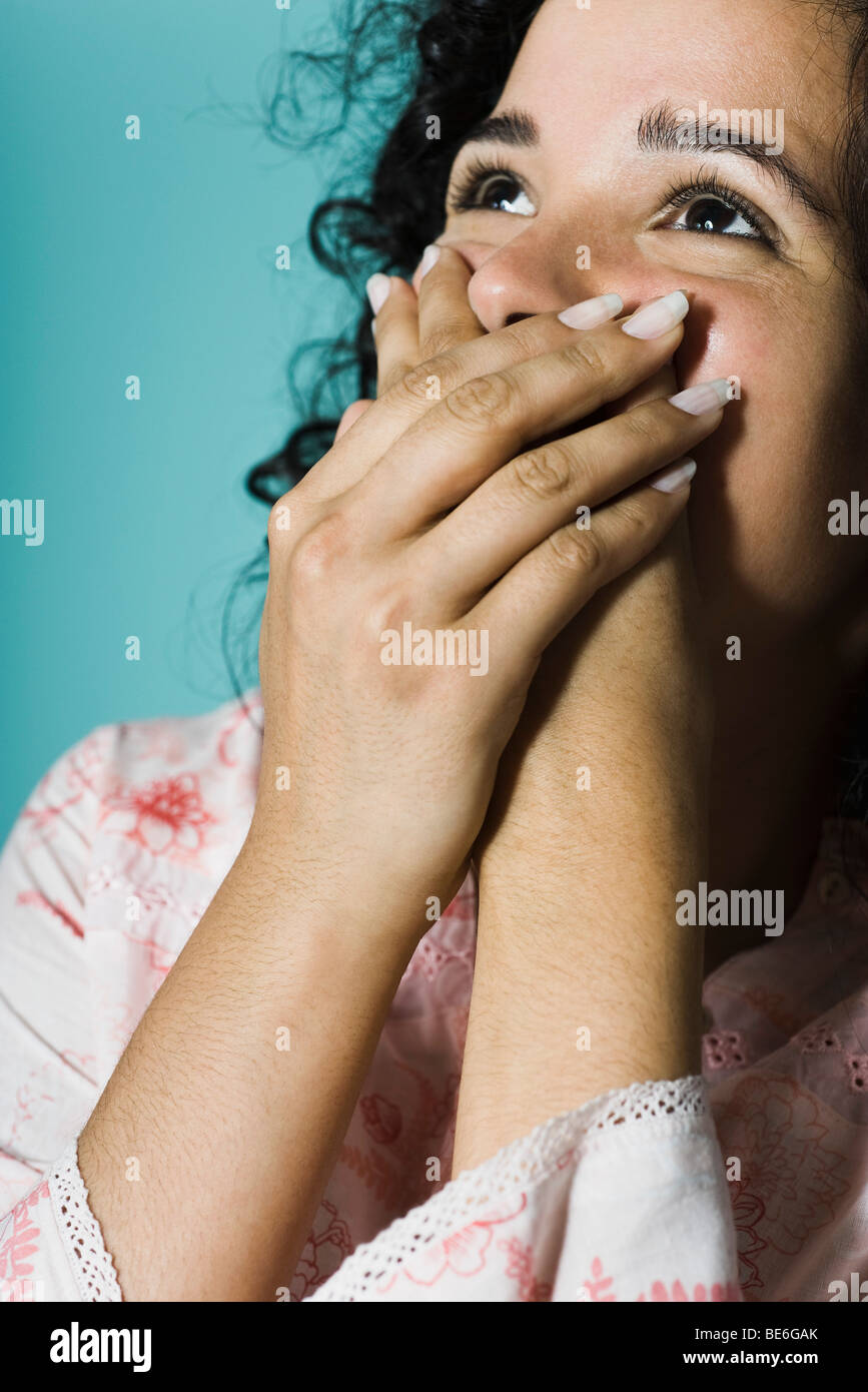 Hands over mouth curly hair hi-res stock photography and images - Alamy