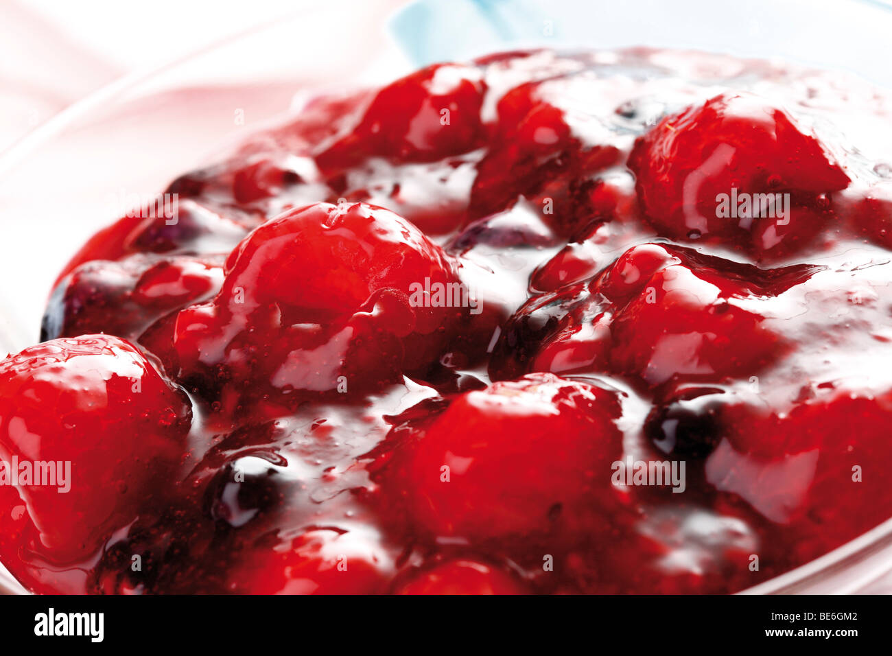Berries in a glass bowl, red berry compote, raspberries, blueberries ...