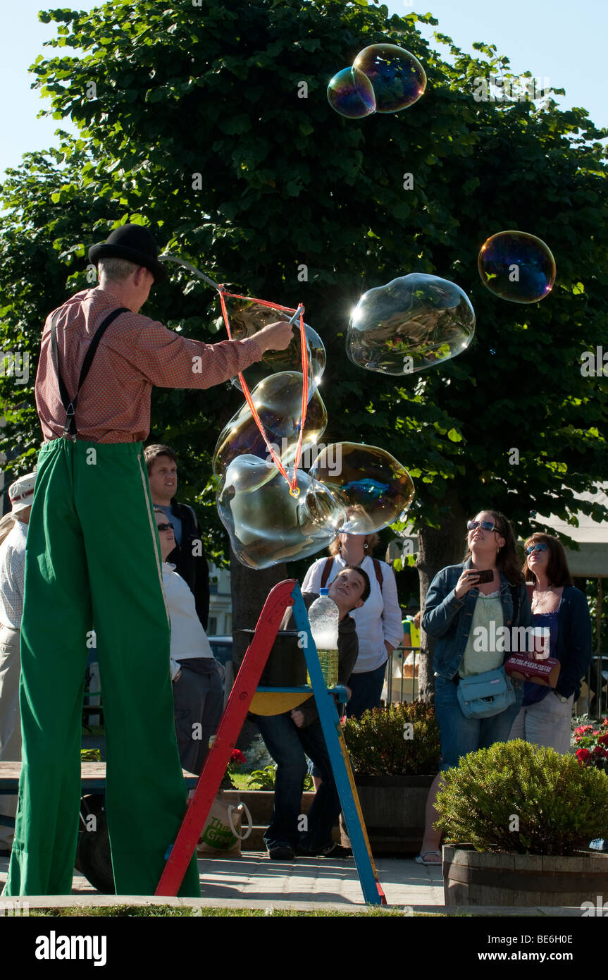 Stilt walker with bubbles at Ludlow Food Festival, Shropshire, England ...