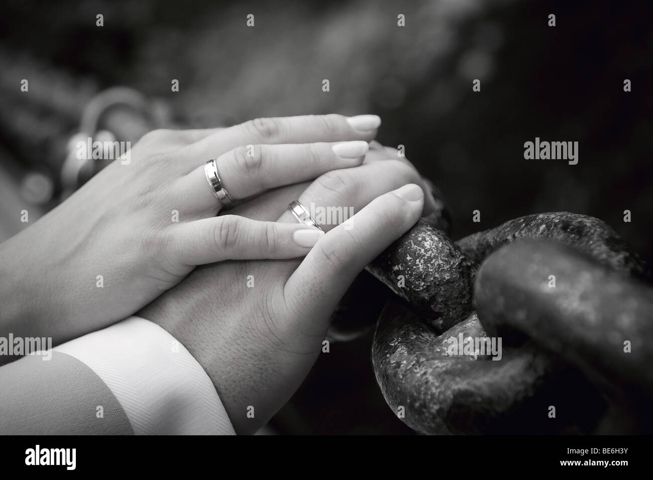 Bride and groom hands with wedding rings in wedding day on a thick ...