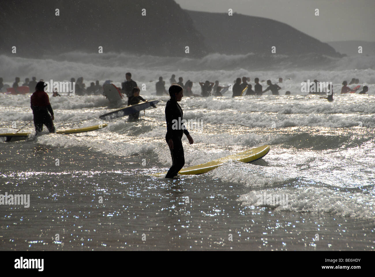 Surfers and body boarders in surf on Perranporth beach Cornwall UK ...