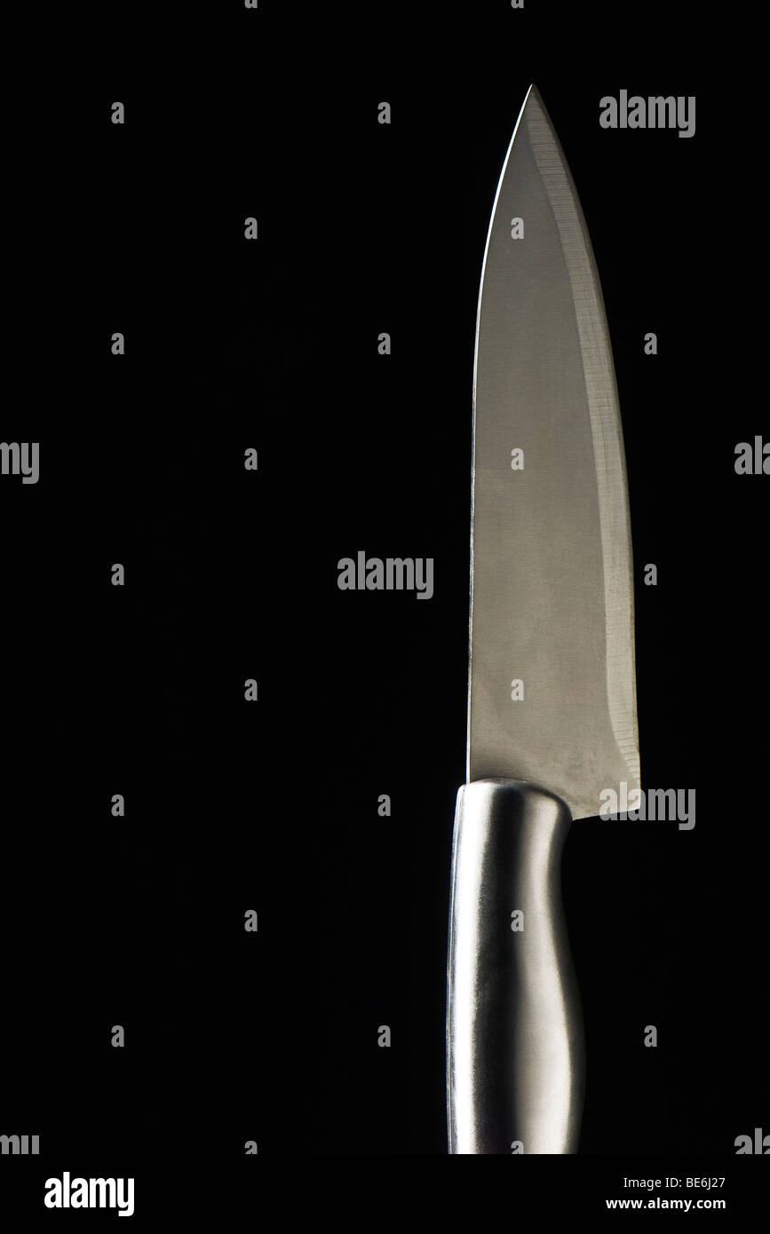 Chef's knife on black background Stock Photo - Alamy