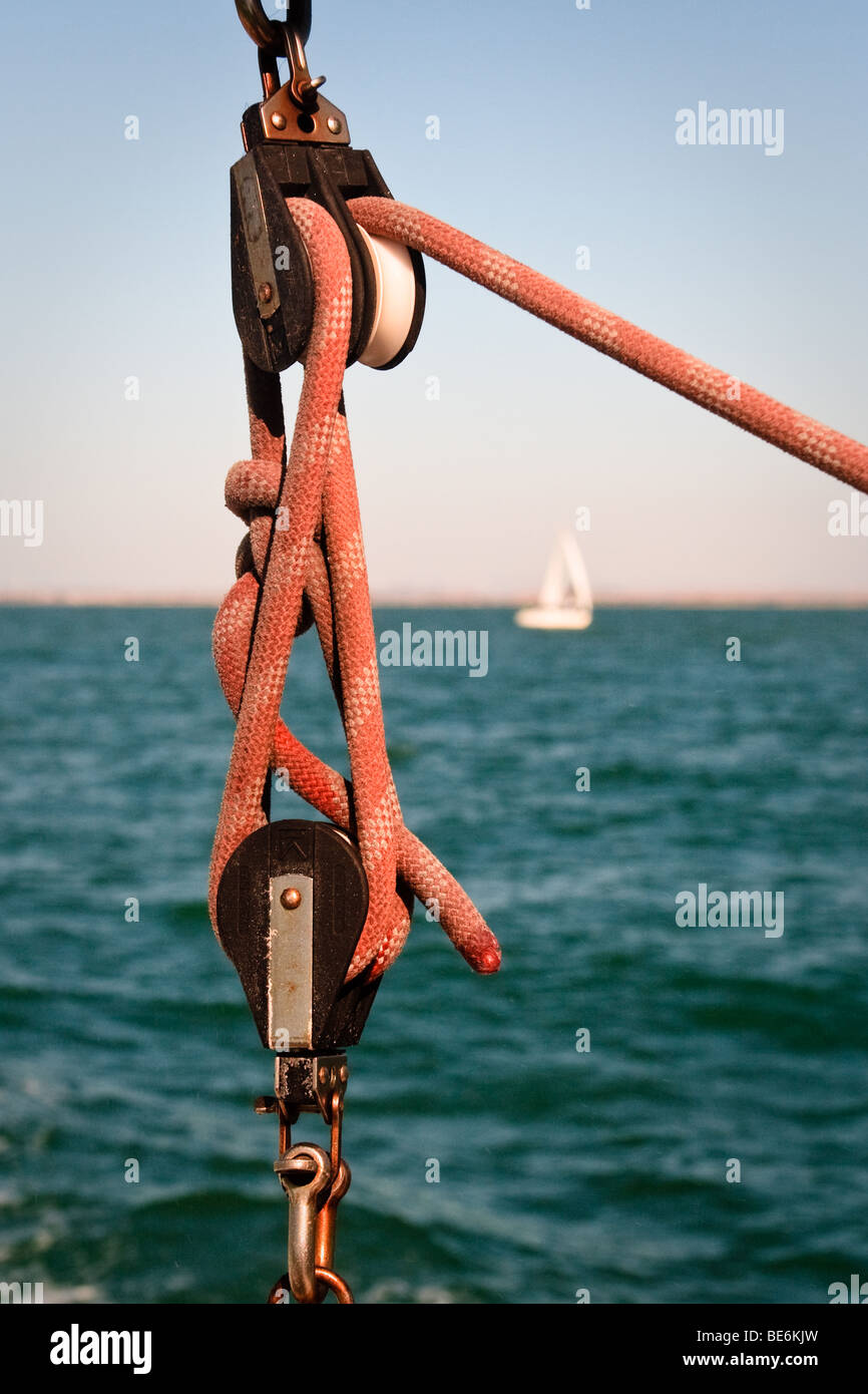 Ropes with a Sailing Ship in the Horizon Stock Photo - Alamy