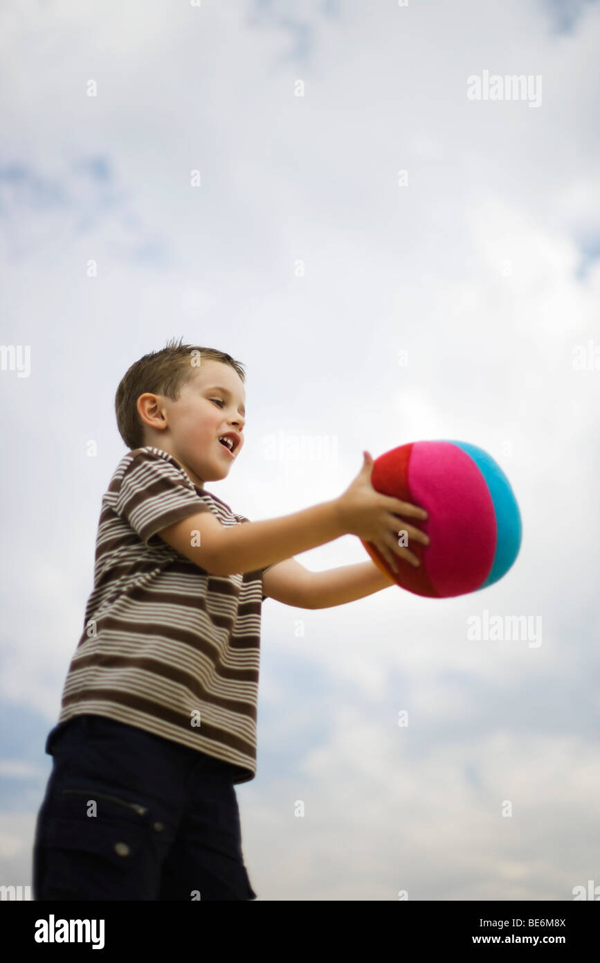 Little boy catching ball Stock Photo - Alamy