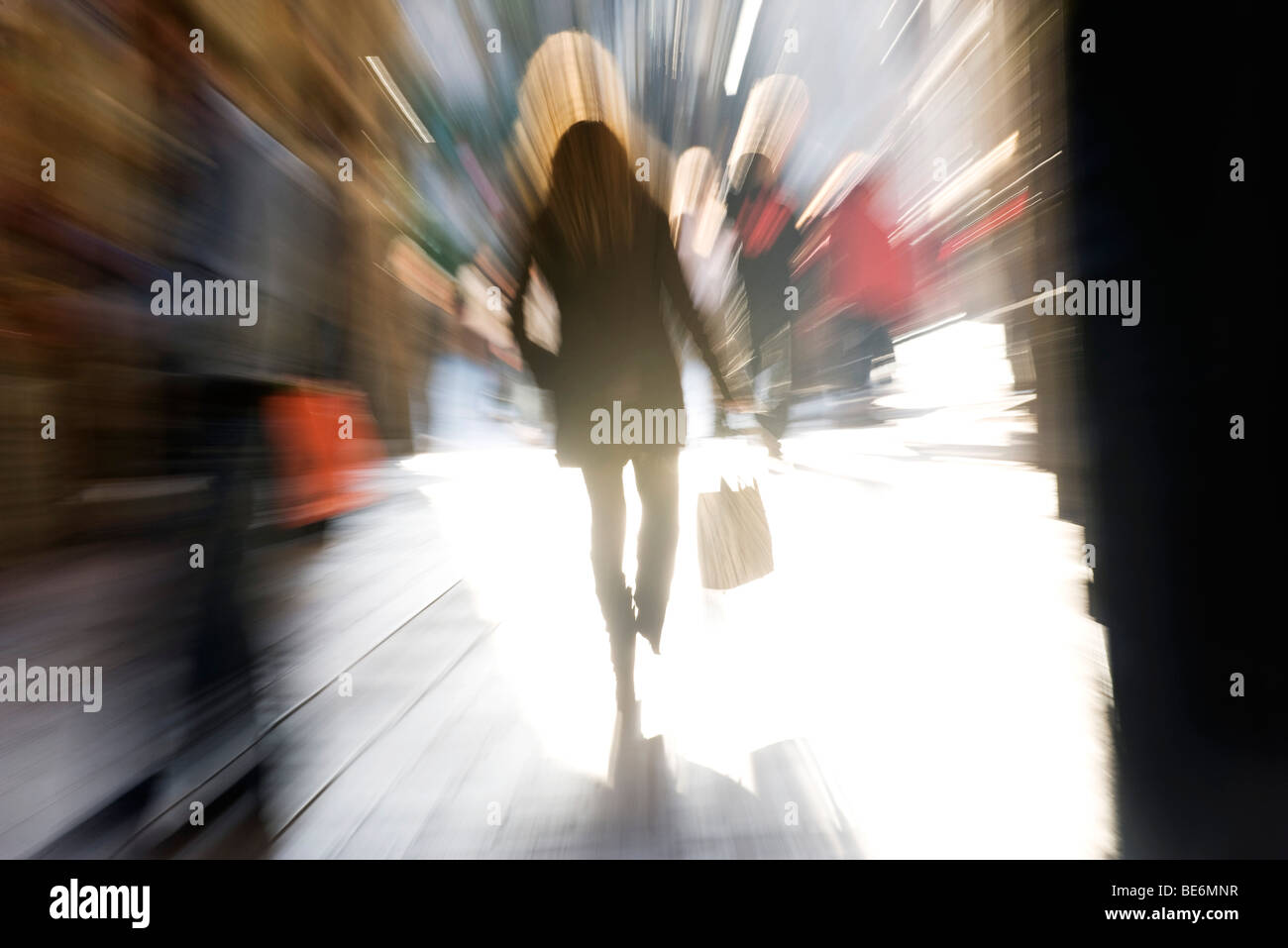 Pedestrian walking, rear view, blurred Stock Photo - Alamy