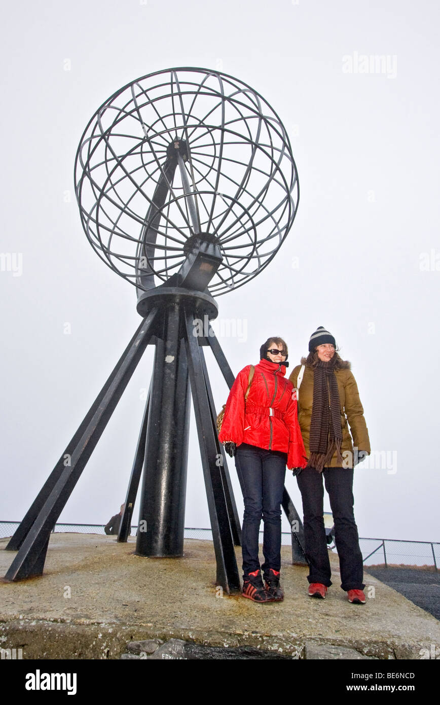Tourists at the globe at North Cape, Norway at 71 degrees, 10 minutes ...