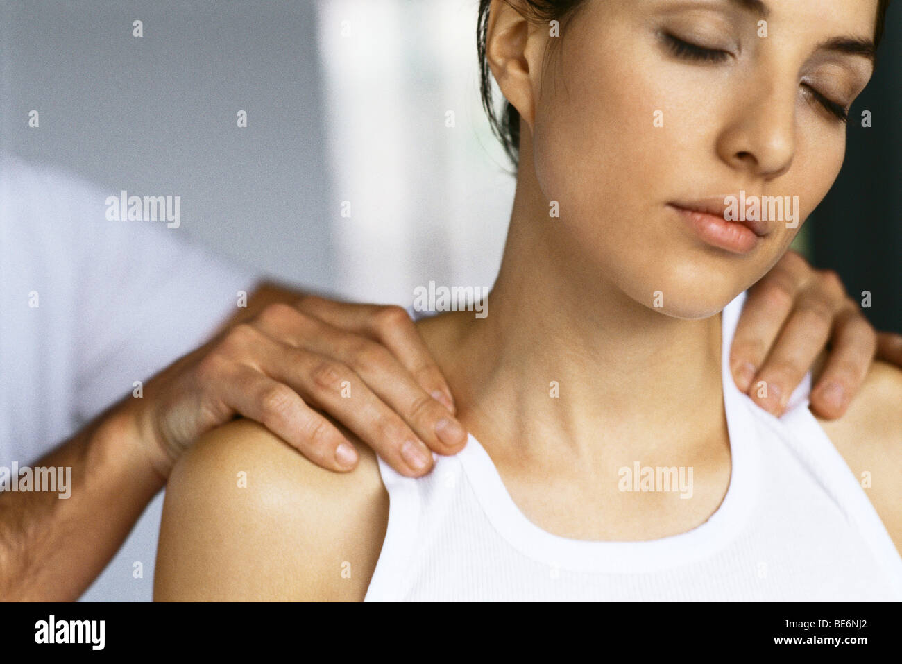Woman enjoying shoulder massage Stock Photo - Alamy