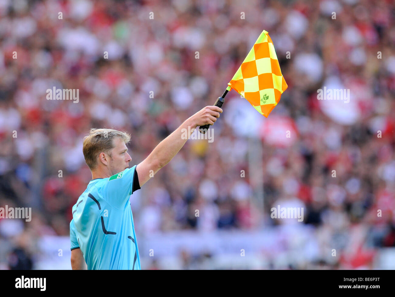 Linesman, assistant referee Thorsten Schiffner indicating offside with ...