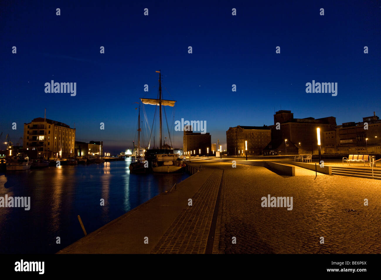 Old harbor of Wismar, Germany, with sailing boats and storehouse by ...