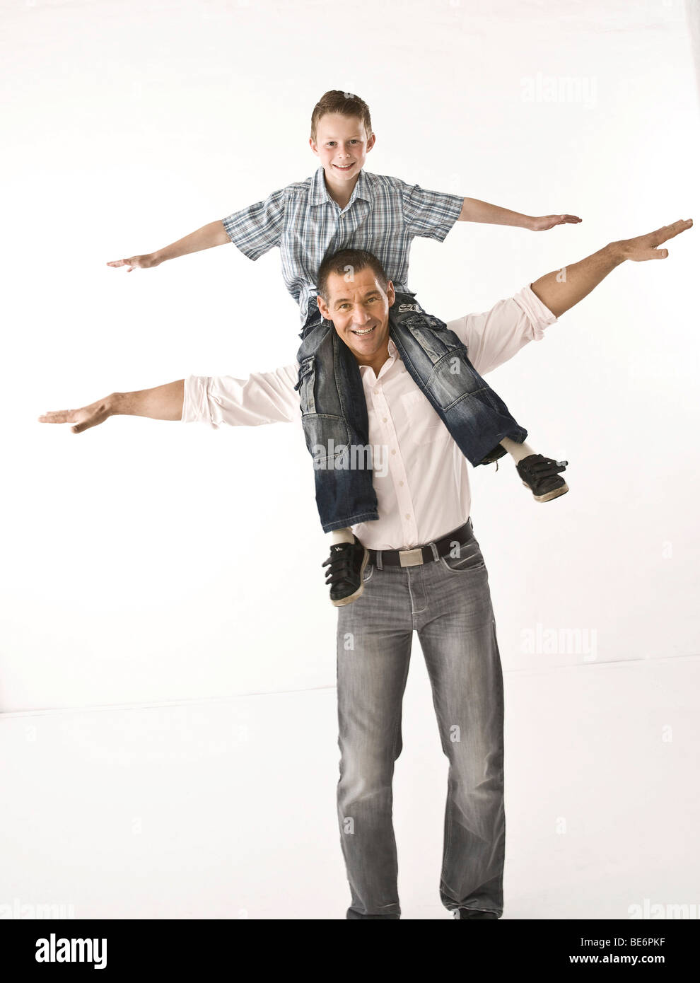 Father carrying his son on his shoulders Stock Photo - Alamy