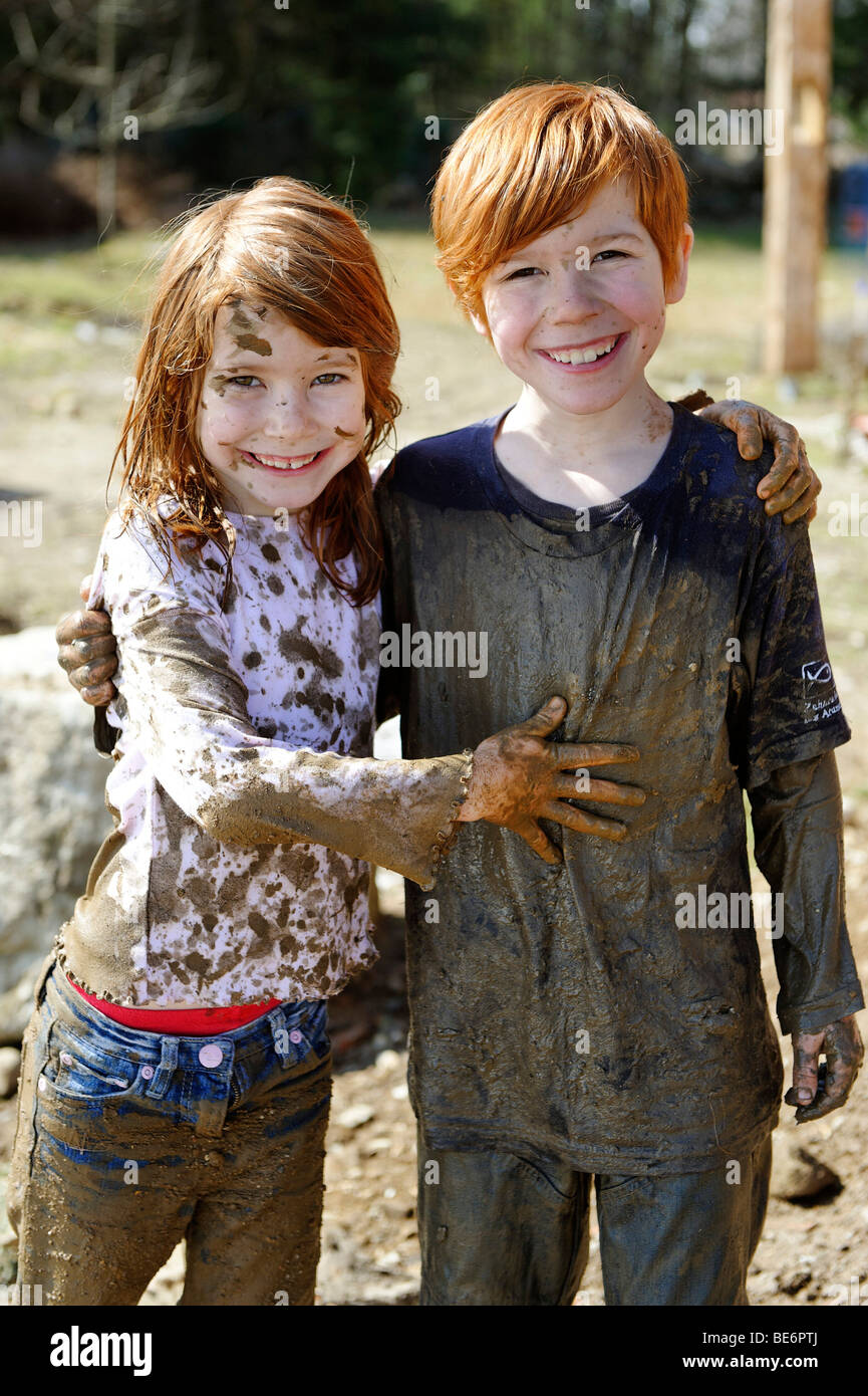 Children, totally covered in mud, dirty, wild, untypical girl Stock ...