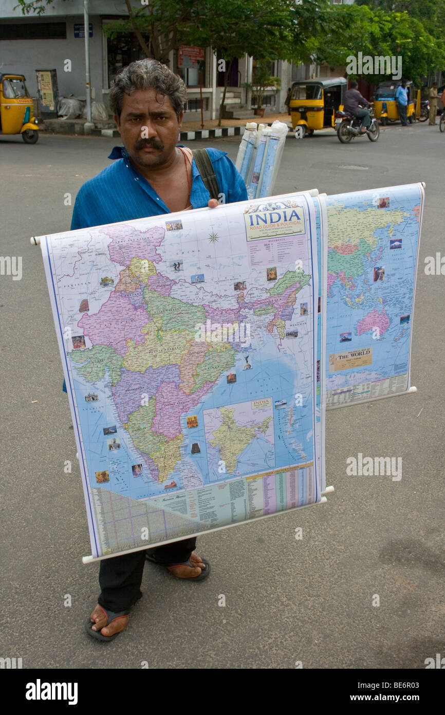 Man selling a map in the street in Pondicherry India Stock Photo - Alamy