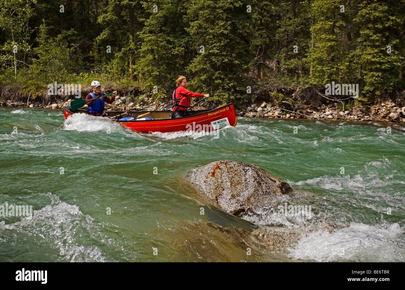 White water canoeing, paddling, rocks and rapids, Wheaton River, Yukon ...