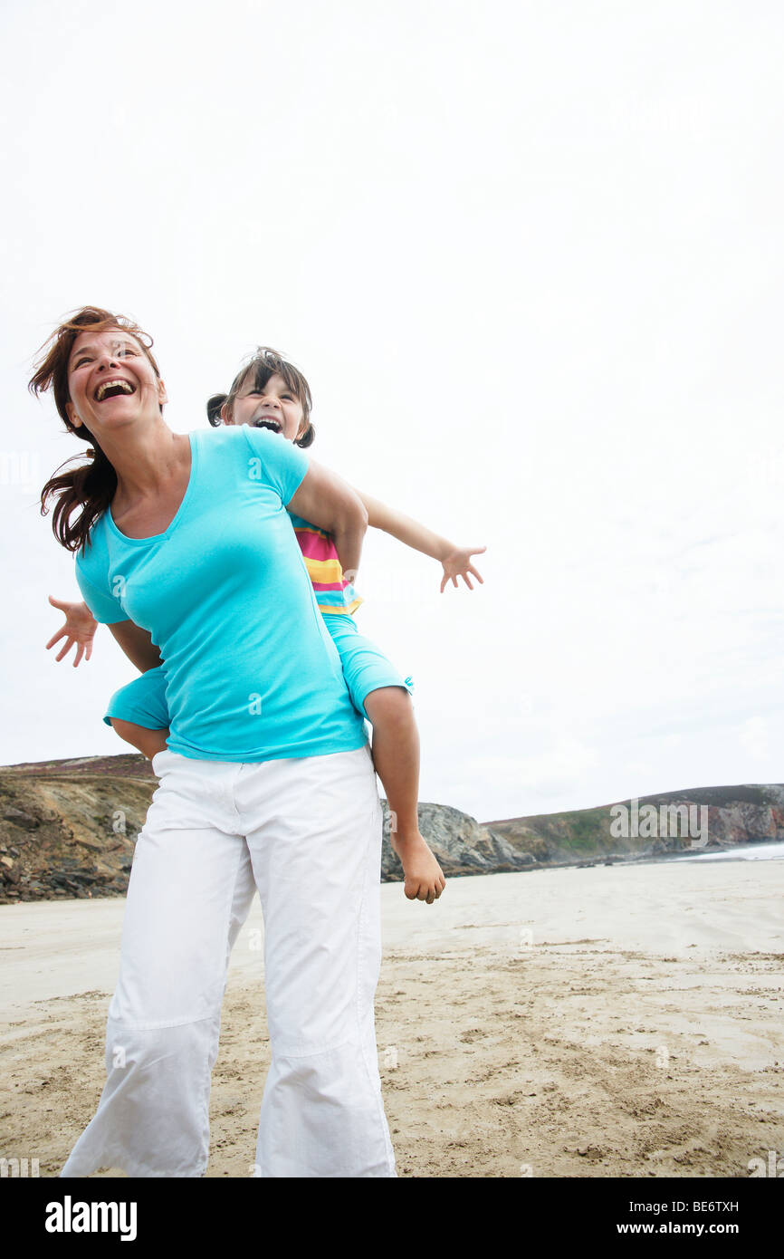 Woman Carrying A Child On Her Back High Resolution Stock Photography ...
