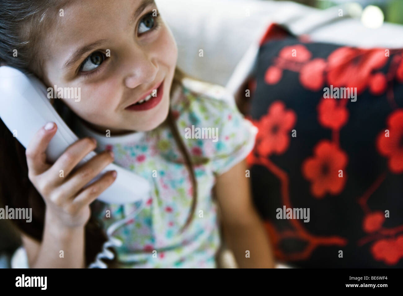 Little girl using landline phone Stock Photo - Alamy