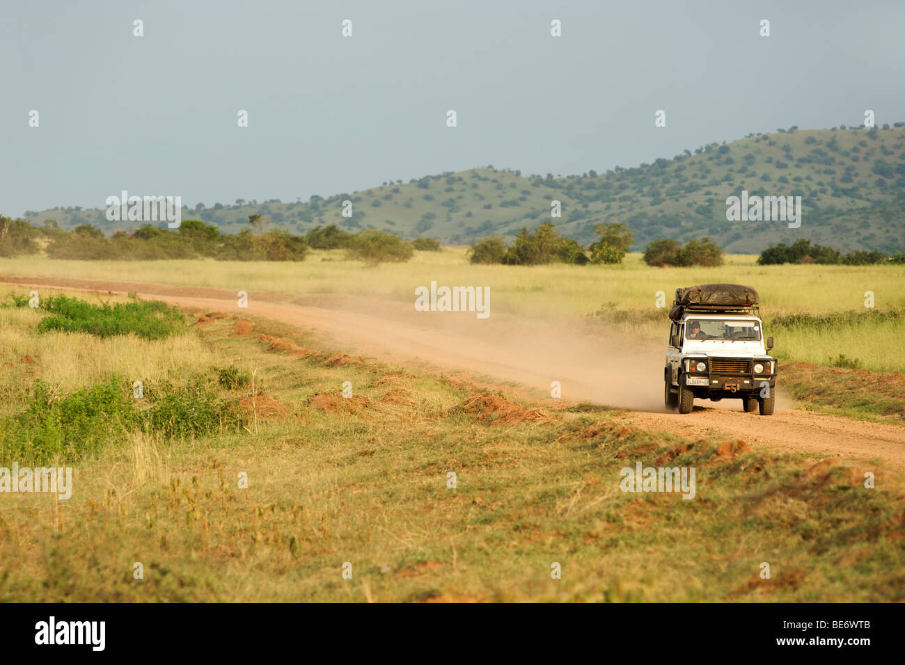 Land Rover Defender driving through the Kabwoya Wildlife Reserve in ...