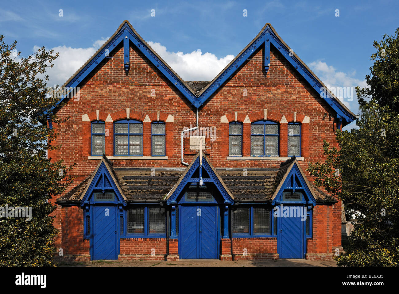 Old brick building with blue doors, High Street, Bluntisham ...