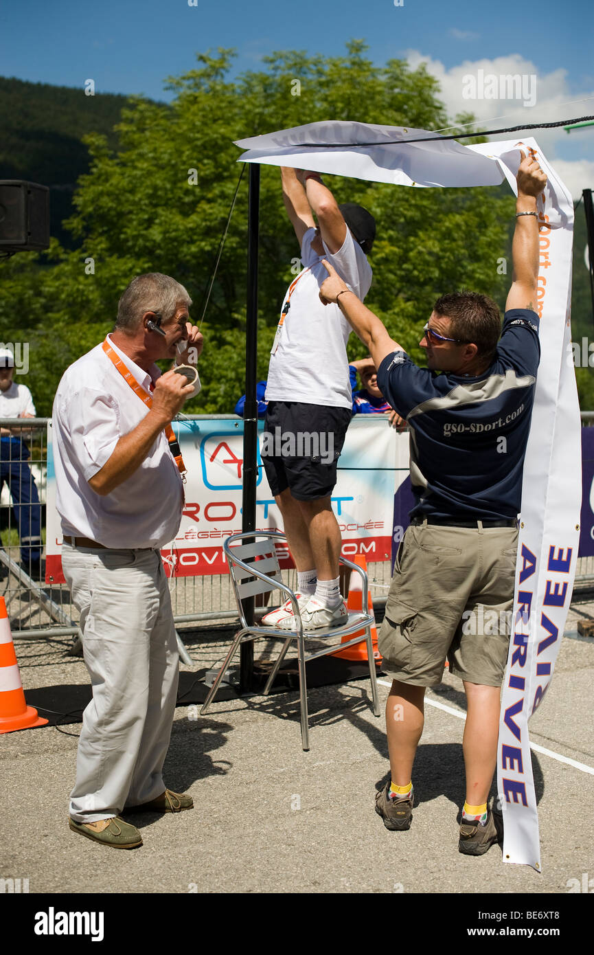 Officials setting up finish line at the tour de ain Stock Photo - Alamy