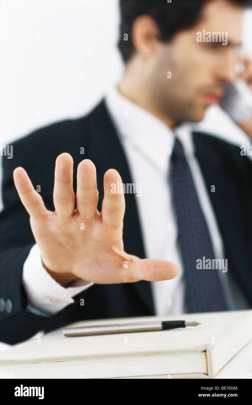 Businessman on phone call, making stop gesture with hand Stock Photo ...