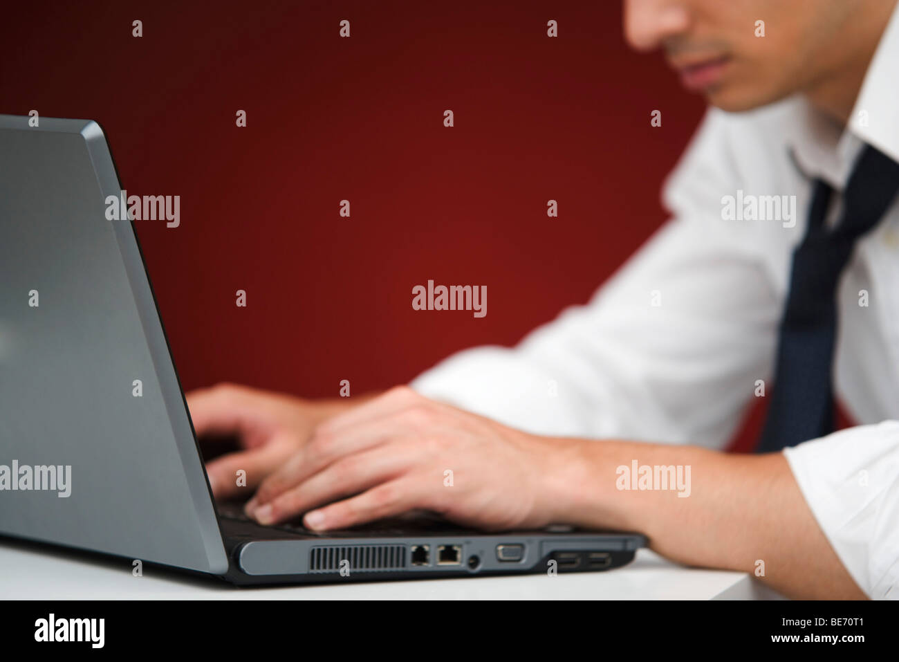 Man using laptop computer Stock Photo - Alamy