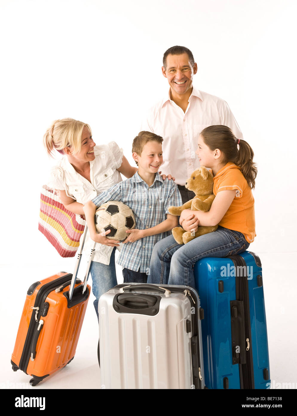Family with packed suitcases Stock Photo - Alamy