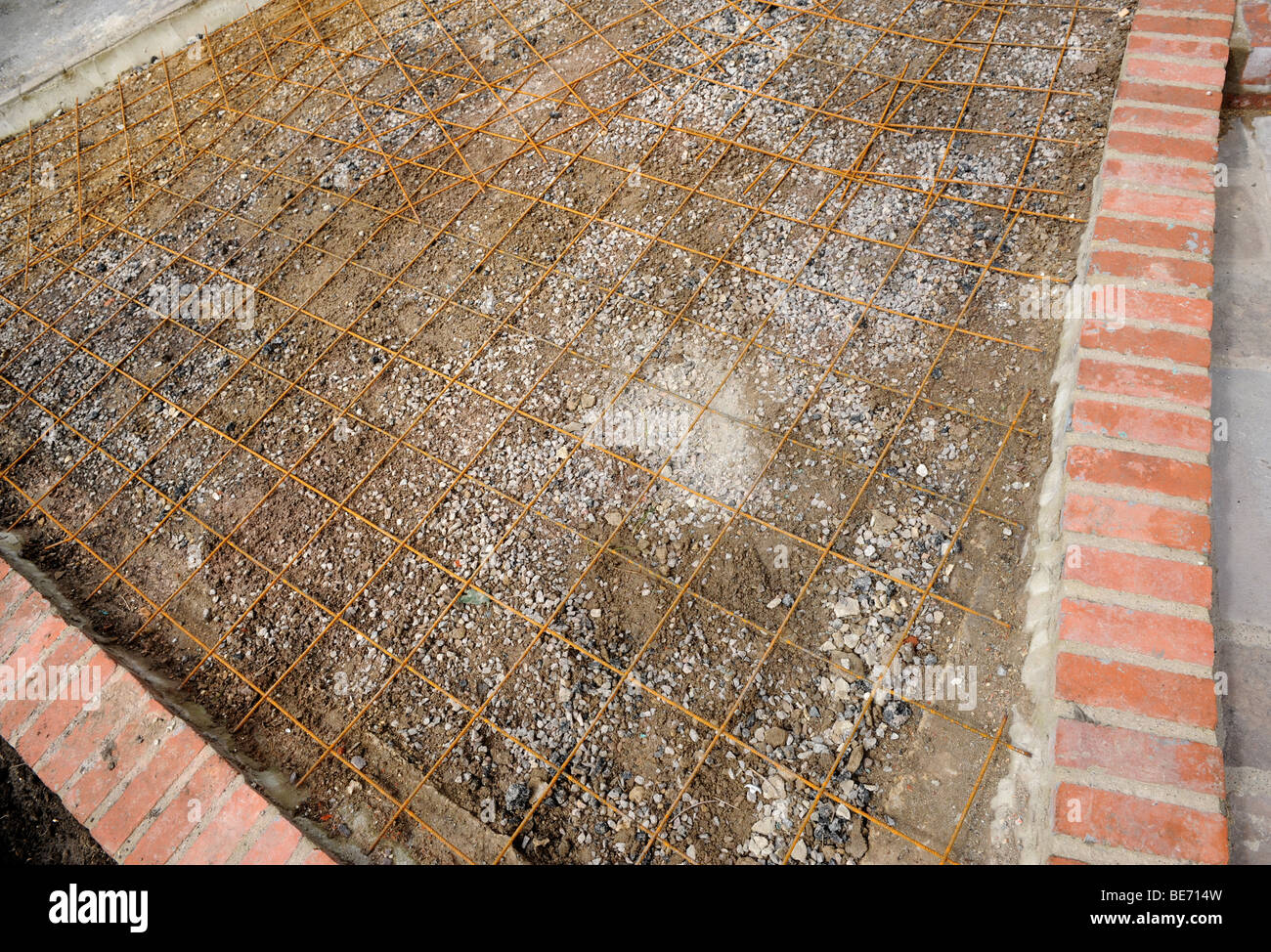 LAYING STEEL MESH IN PREPARATION FOR CONCRETING A HARD BASE FOR A ...