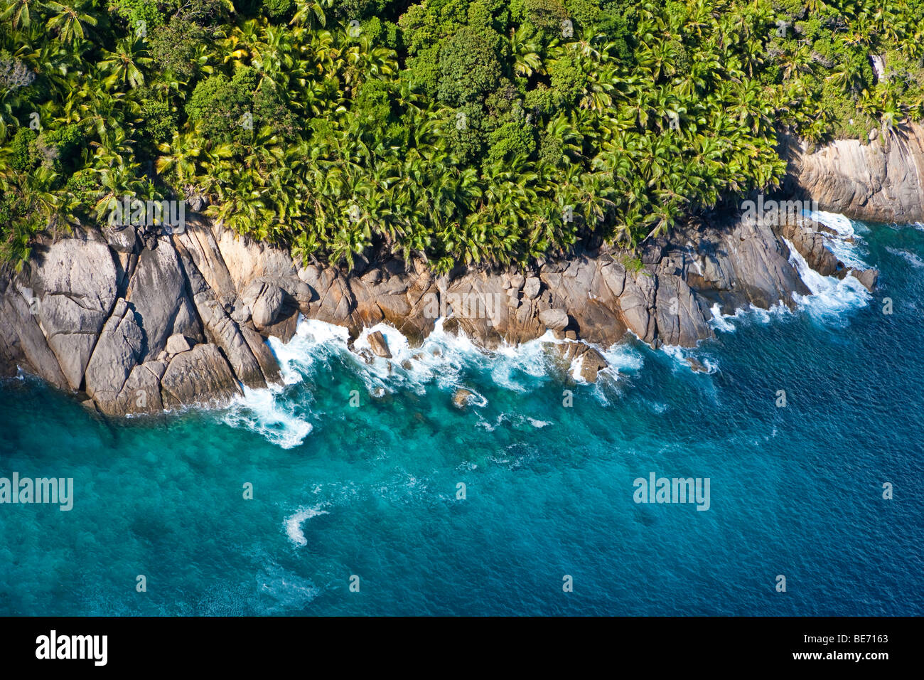 The coast Anse Liberte with the typical granite rocks of the Seychelles ...