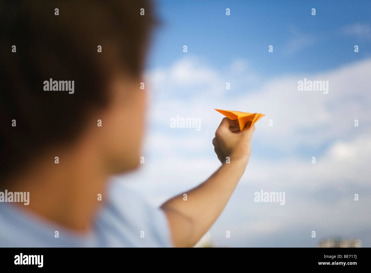 Man throwing paper airplane Stock Photo - Alamy
