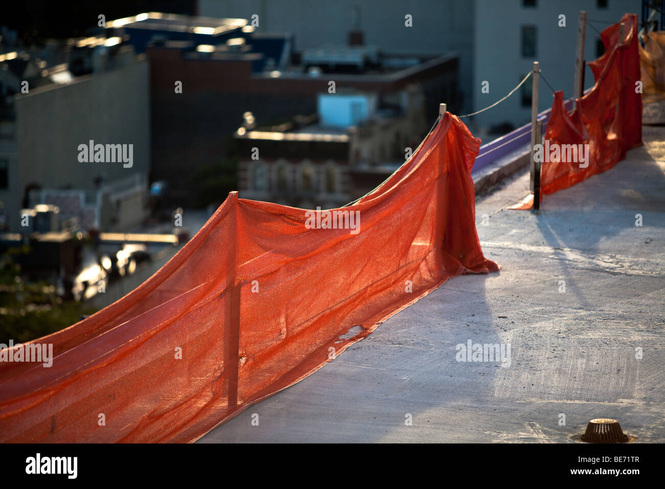 Safety construction net on the rooftop of new building Stock Photo - Alamy