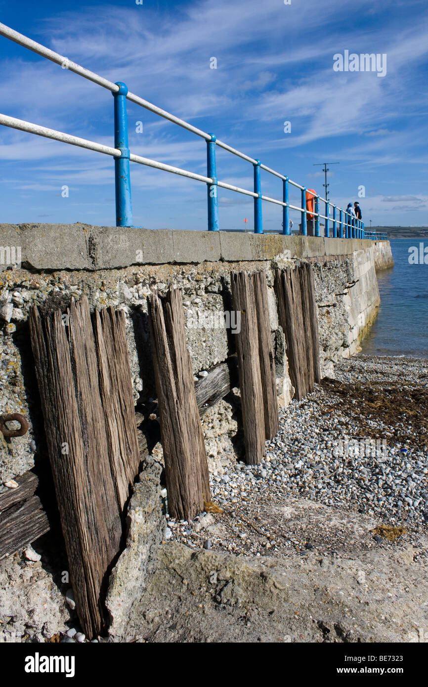 weymouth old pier wall timber baulk beach pebbles dorset england uk gb ...