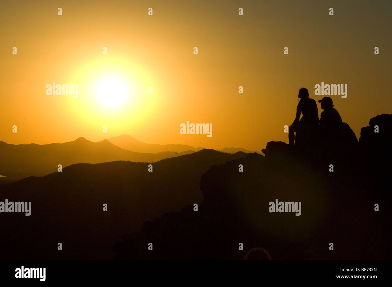 People looking at a sunset in Arizona Stock Photo - Alamy