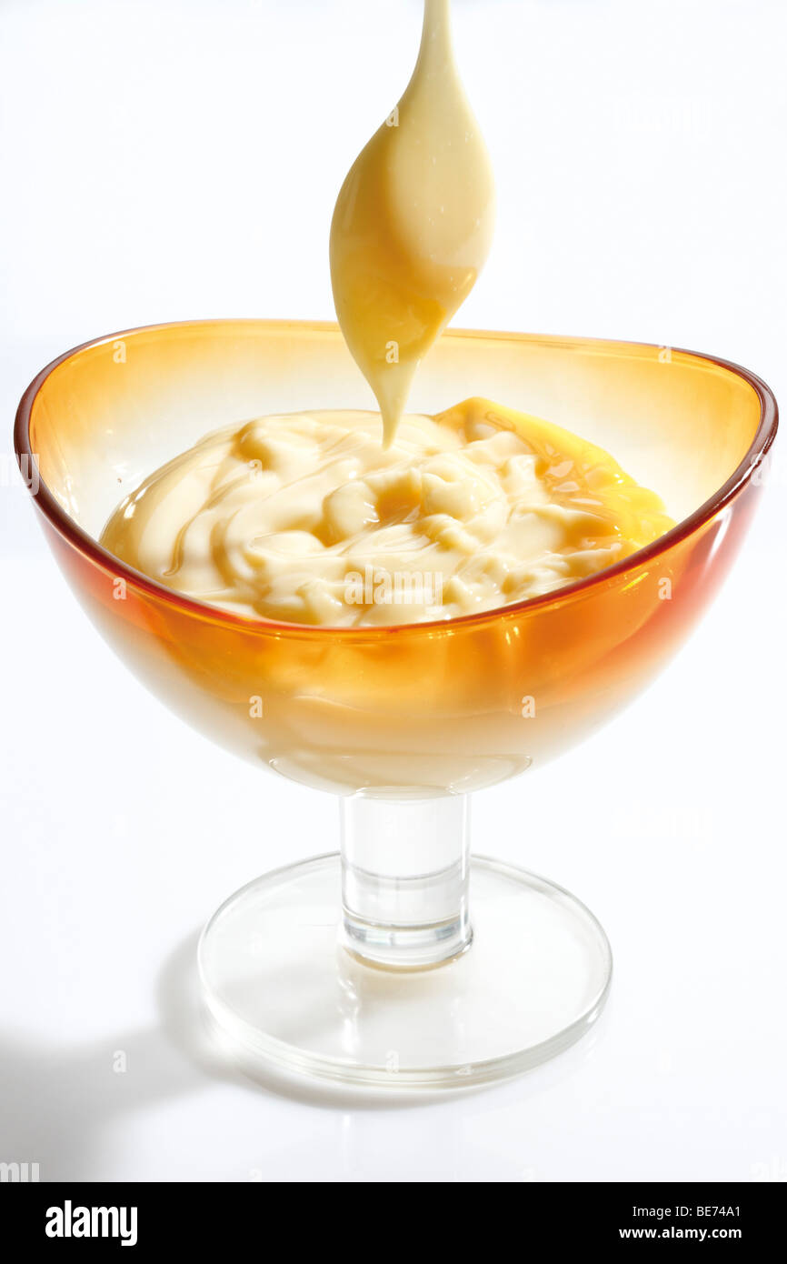 Vanilla pudding in a glass bowl Stock Photo - Alamy