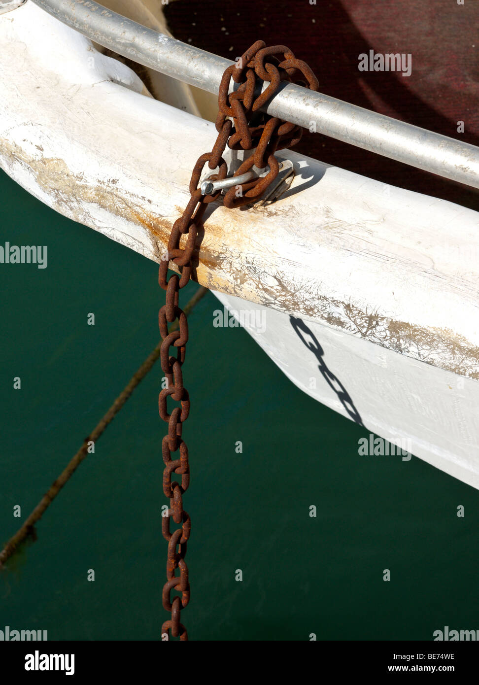 Rusty old chain tied to a boat Stock Photo - Alamy