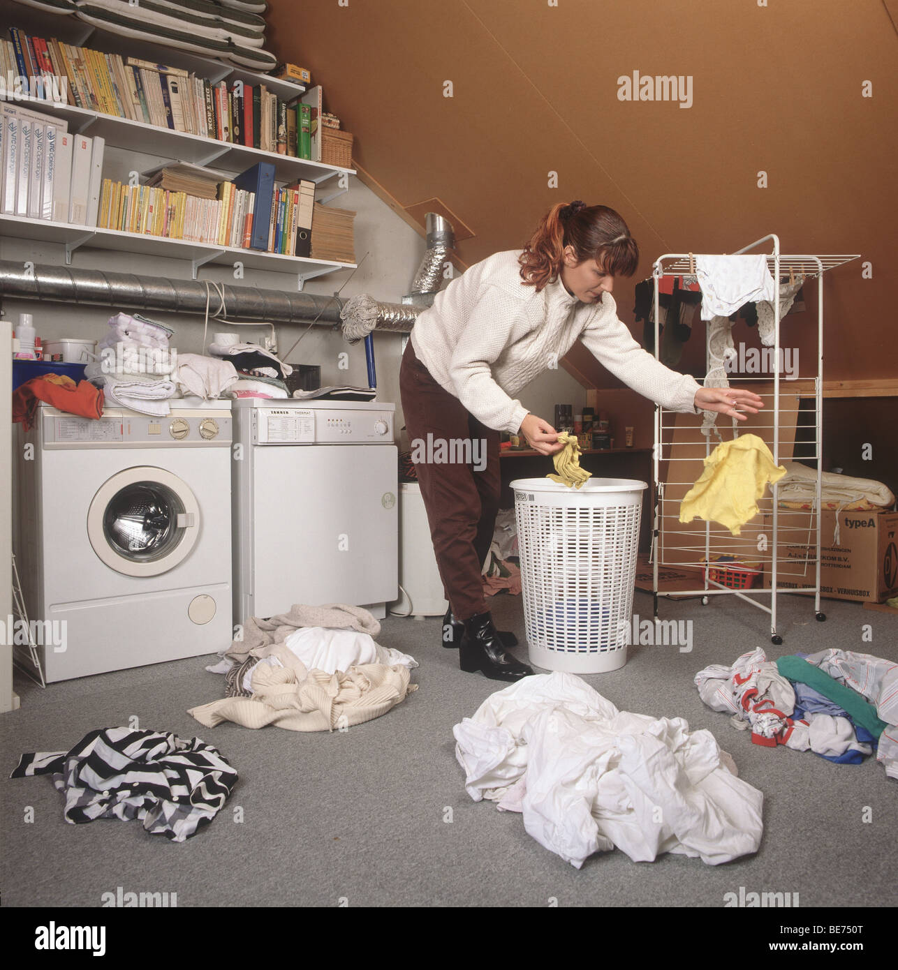 Woman Sorting Clothes Out High Resolution Stock Photography and Images ...