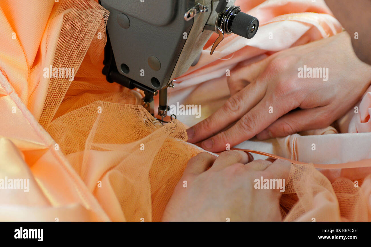 Dressmaker sewing with a sewing machine Stock Photo - Alamy