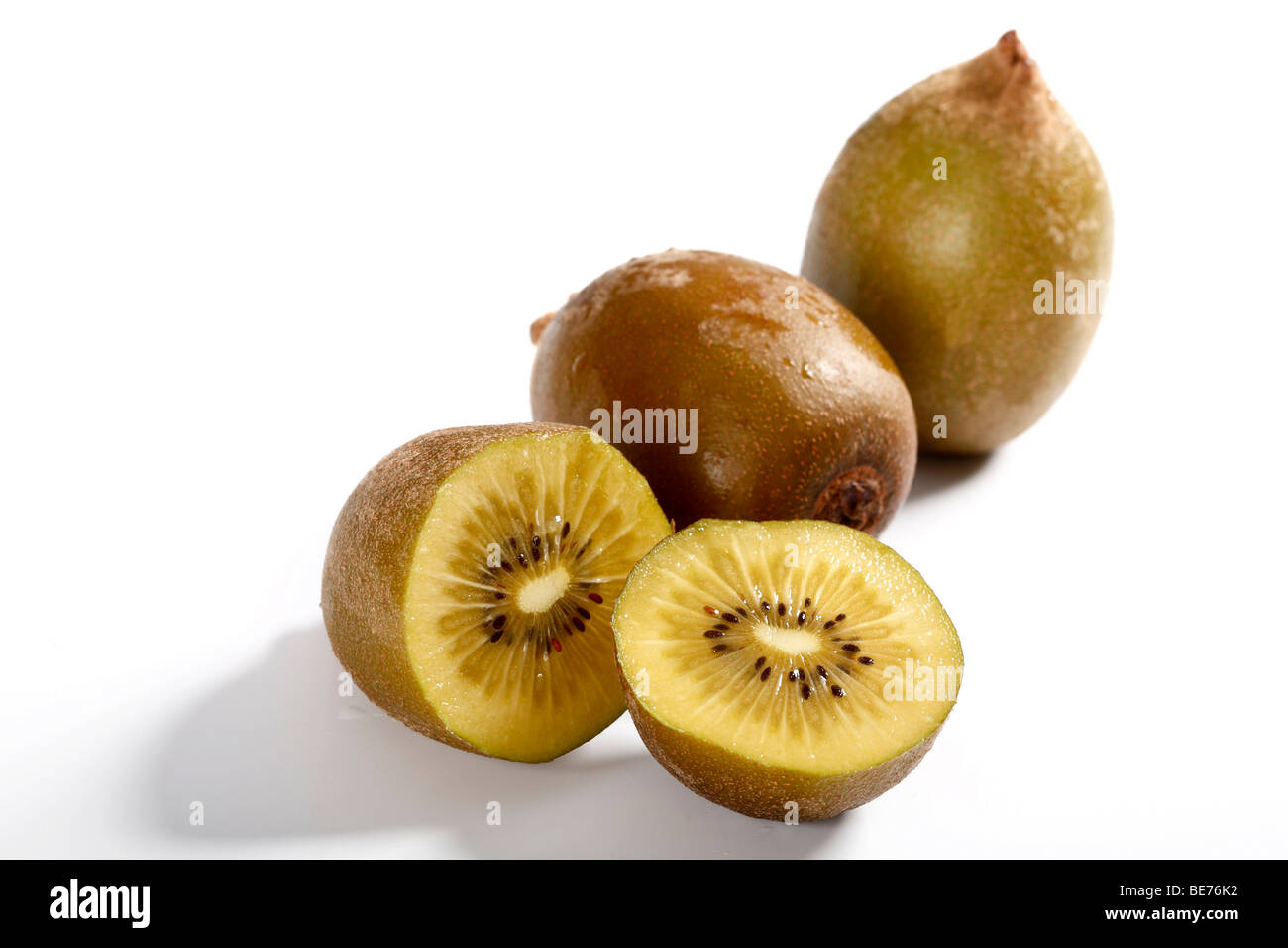 Gold kiwi, one halved Stock Photo - Alamy